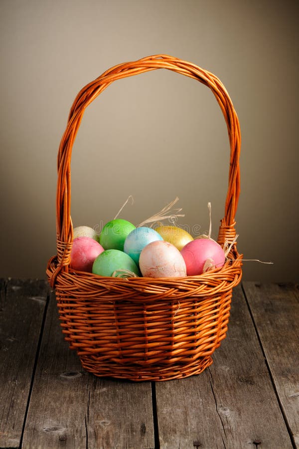 Colored Easter Eggs in Basket Stock Image - Image of gold, brown: 28635525