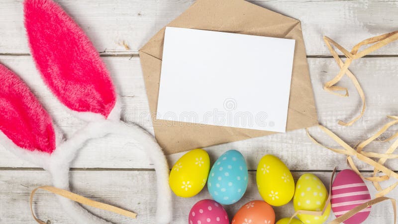 Colored Easter Eggs and Rabbit Ears and Envelope and Blank for Text on ...