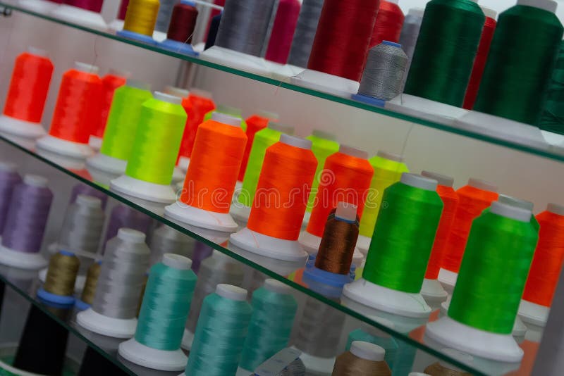 Colored Embroidery Spools with Thread Stock Photo - Image of threaded ...
