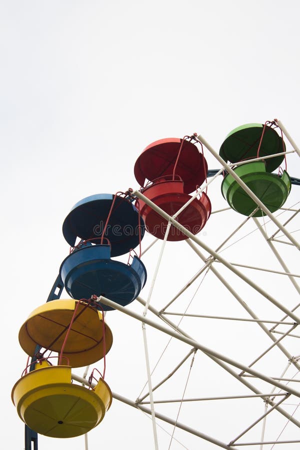 Colored Ferris Wheel and Cloudy Sky Stock Photo - Image of back ...