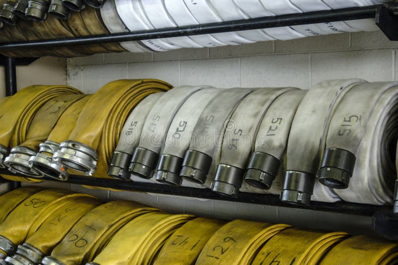Colored Fire Hoses Rolled and Placed on Racks in the Fire House ...