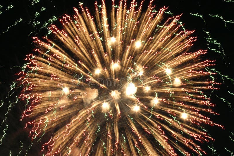 Colored firework at night stock photo. Image of bright - 83259386