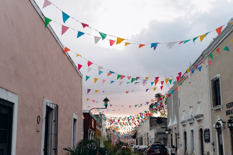 Colored Flags Against a Pink Sunset Sky in a Colonial Spanish Town ...