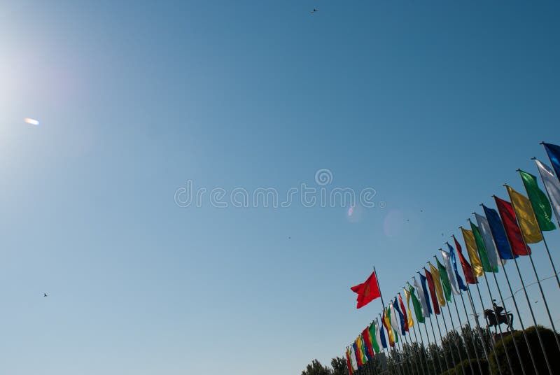 Colored flags in the sun stock image. Image of yellow - 48554151