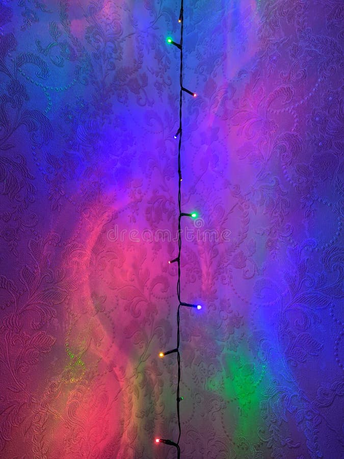 Colored Garland Shines in Different Colors and is Reflected from the ...