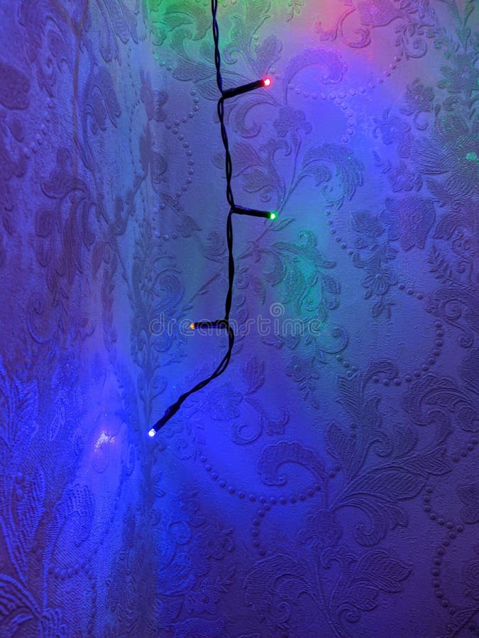 Colored Garland Shines in Different Colors and is Reflected from the ...