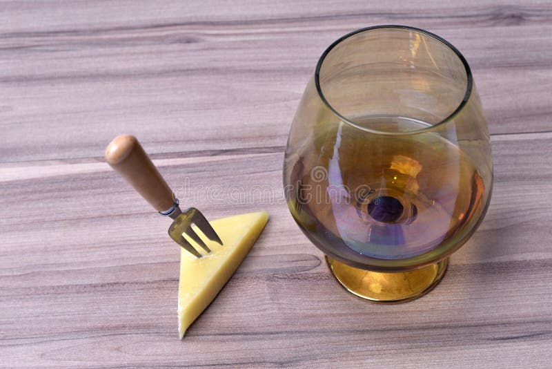 Colored Glass Goblet with Cognac and Cheese Stock Photo - Image of ...
