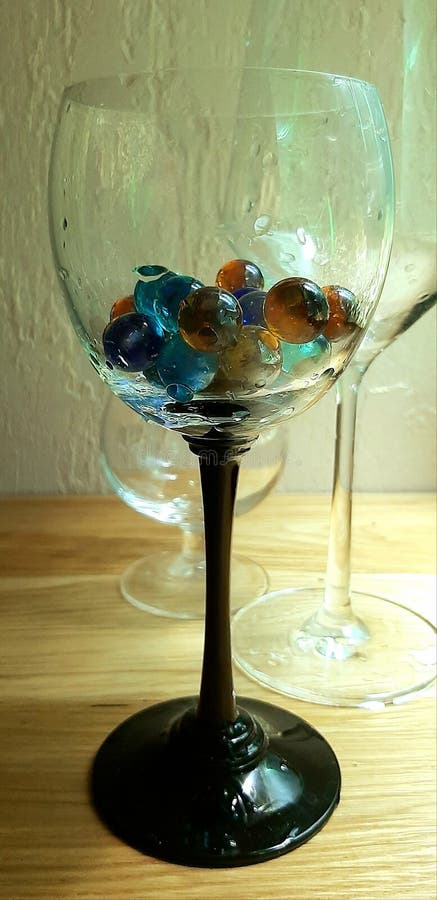 Colored glass shere stock photo. Image of paty, wood - 183564176