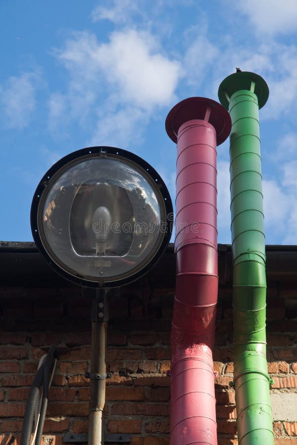 Colored Gutter Pipes and Street Lamp Stock Photo - Image of blue ...