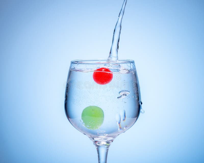 Colored Ice Balls Droped into Coctail Glass . Stock Photo - Image of ...