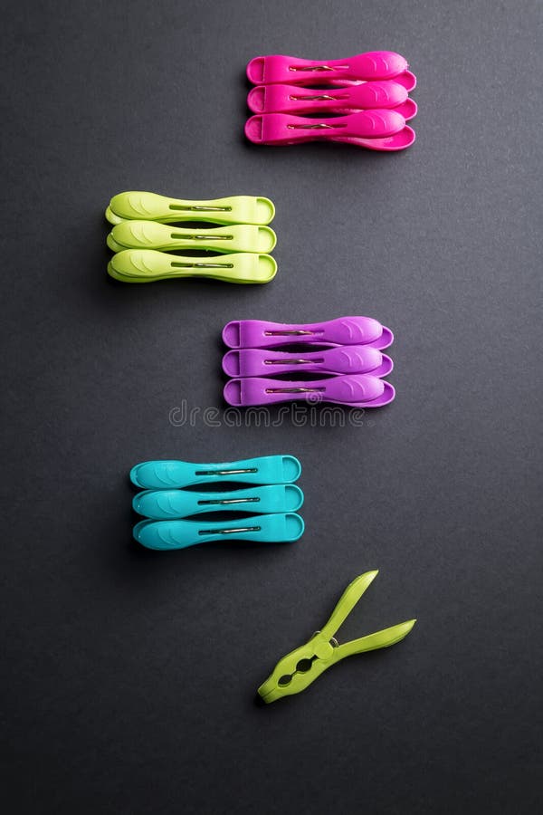 Colored Laundry Clips Over a Black Background Above View Stock Image ...