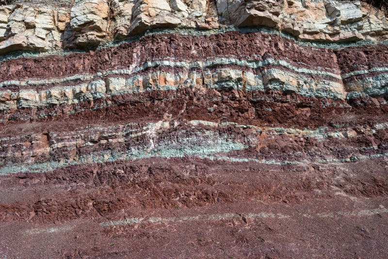 Colored Layers of Clay and Stone in the Soil Section Stock Image ...
