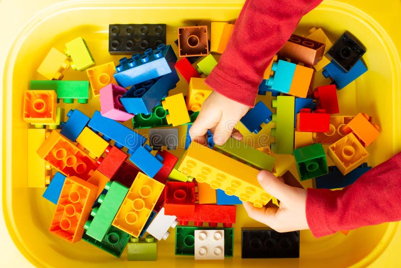 Colored Lego Child S Hands. Top View on Child S Hands with Heart Made ...