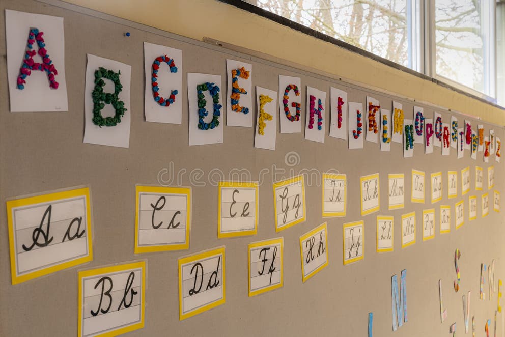 Colored Letters in Block and Cursive on the Wall of a Primary School ...