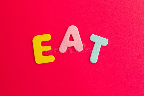Colored Letters Eat on Red Background with Copy Space Stock Image ...