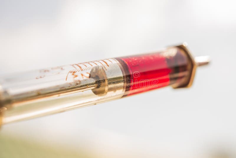 Colored liquid syringe stock photo. Image of drug, background - 120217444