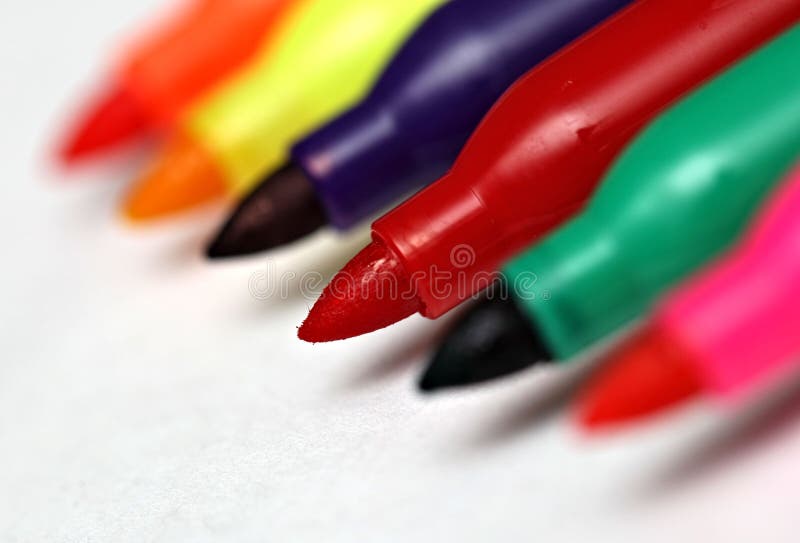 A Set of Colored Markers and a Sheet of White Paper on the Table. Stock ...