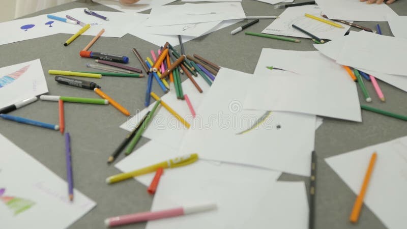 Colored Markers on the Tables with Sheets of Paper Stock Footage ...