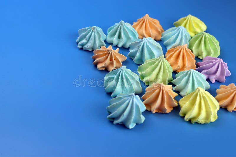 Colored Meringues on a Blue Background. Desert, Sweets, Cake Shop ...
