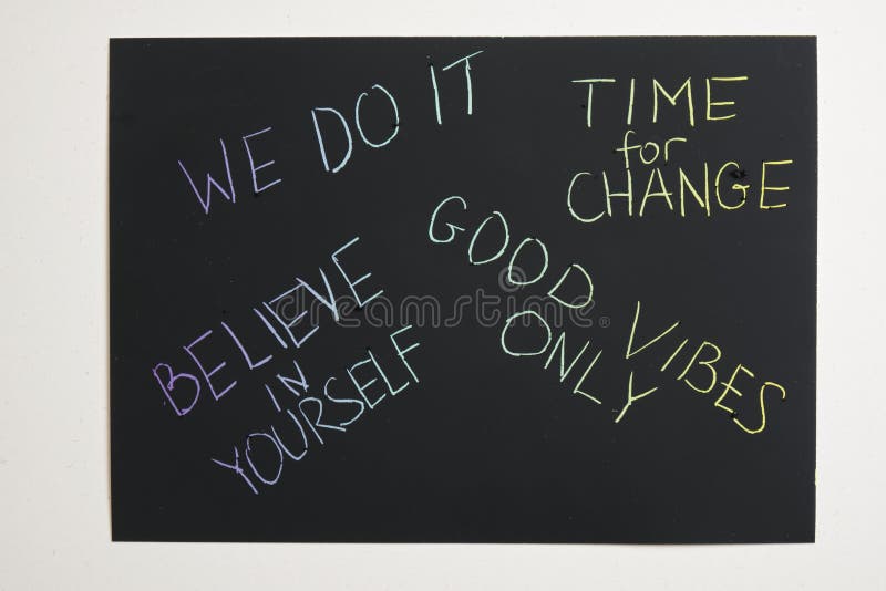 Colored Motivational Slogans are Scratched on on a Black Engraving ...