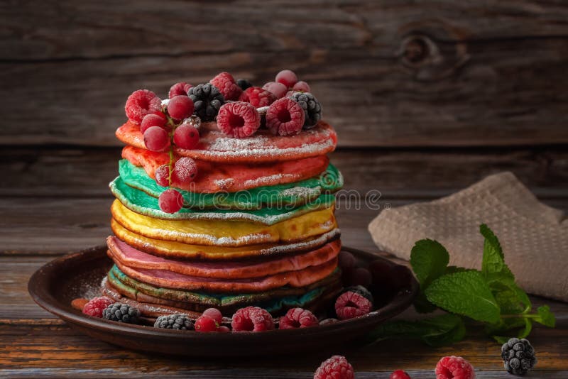 Colored Pancakes with Fruit, Almonds and Powdered Sugar. Stock Image ...