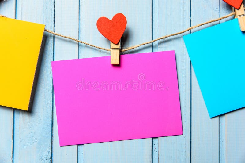 Colored Paper Sheets on Thread with Heart Shaped Clothespin Blue Wooden ...