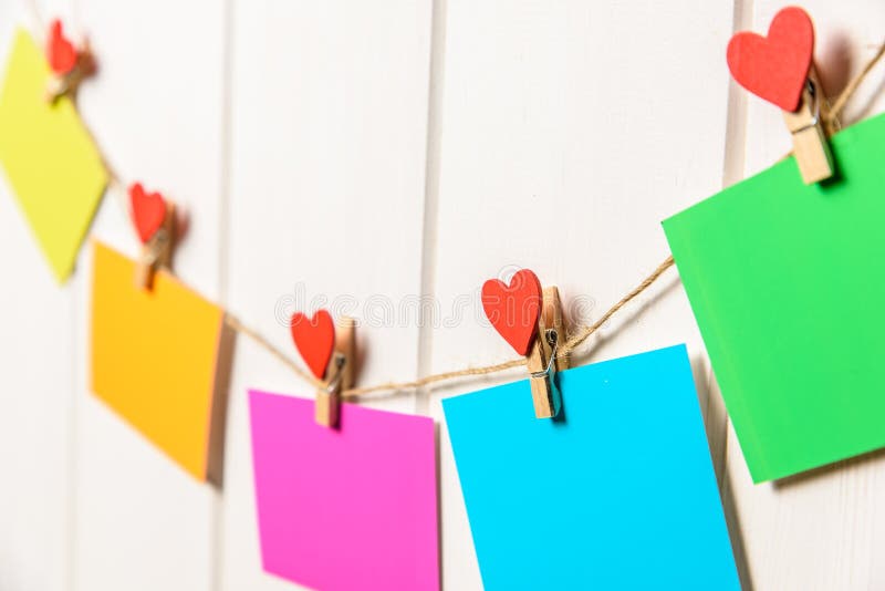 Colored Paper Sheets on Thread with Heart Shaped Clothespin White ...