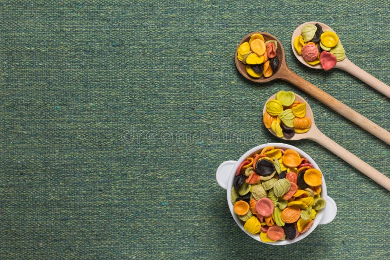 Colored Pasta in a Plate and Spoons Stock Photo - Image of noodle ...
