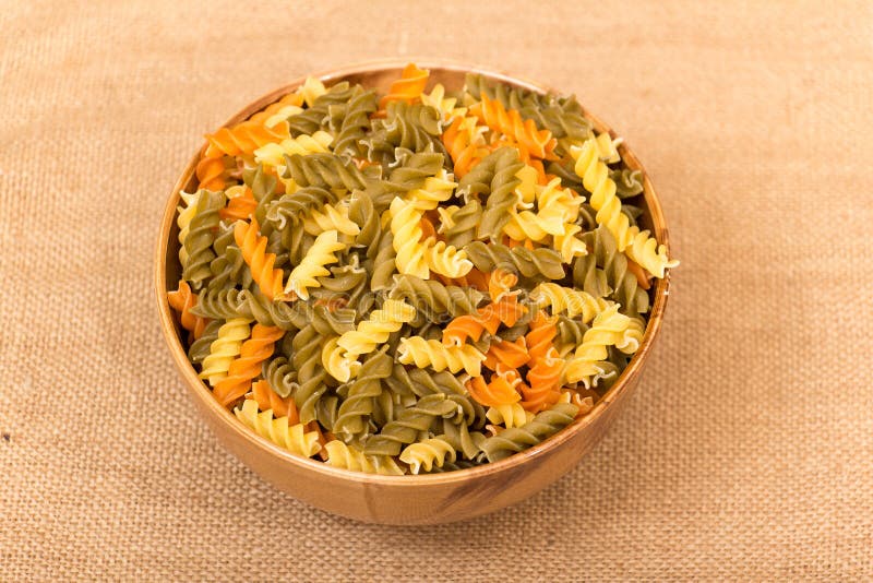 Colored pasta in a plate stock photo. Image of mutli - 54347292