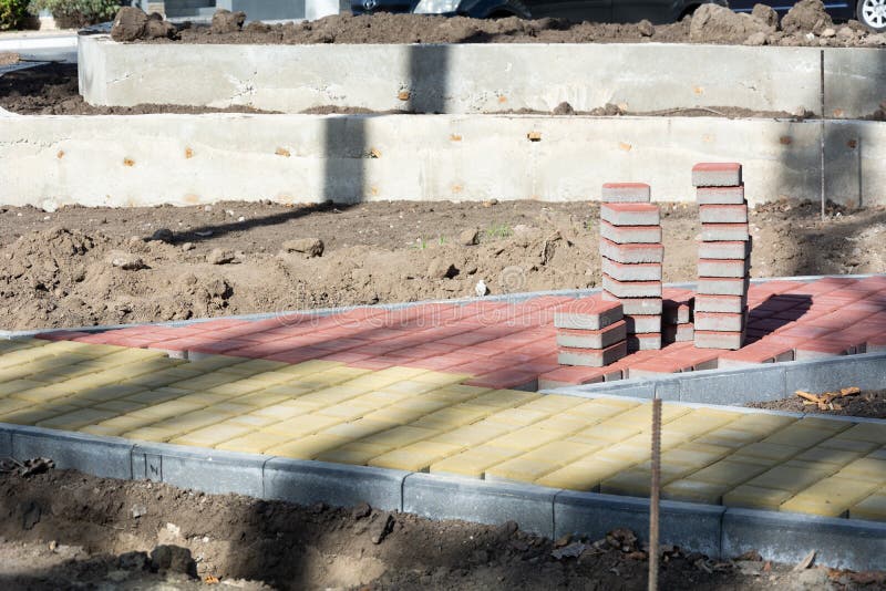 Colored Paving Slabs. Construction of Footpaths from Paving Slabs Stock ...