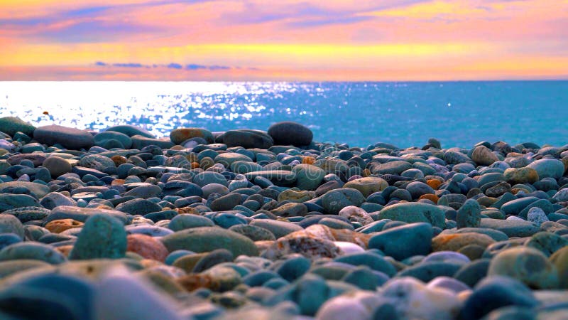 Colored pebbles on a beach stock photo. Image of idyllic - 173425342