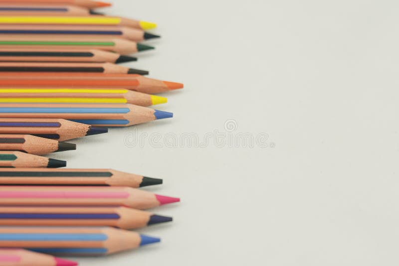 Colored Pencils Come from the Left in a White Background Stock Photo ...
