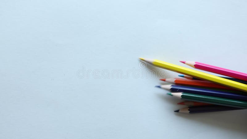 Colored Pencils Dropping on the Right Side of White Table Background ...