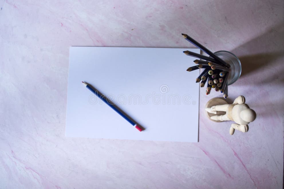Colored Pencils, Empty Paper and Dummy for Sketching on the Table ...
