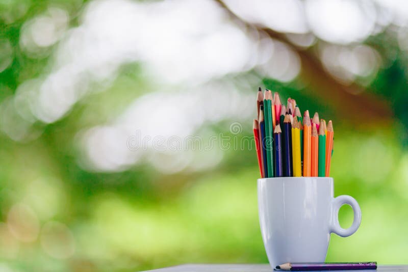 Colored Pencils in a Glass on Bokeh Background Stock Image - Image of ...