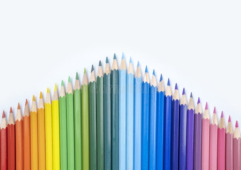 Closeup of Colored Pencils Lined Up in a Row and Abstract Shape on ...
