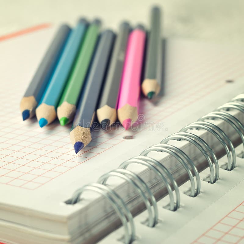 Colored Pencils on Notebook Stock Photo - Image of multi, black: 25137798