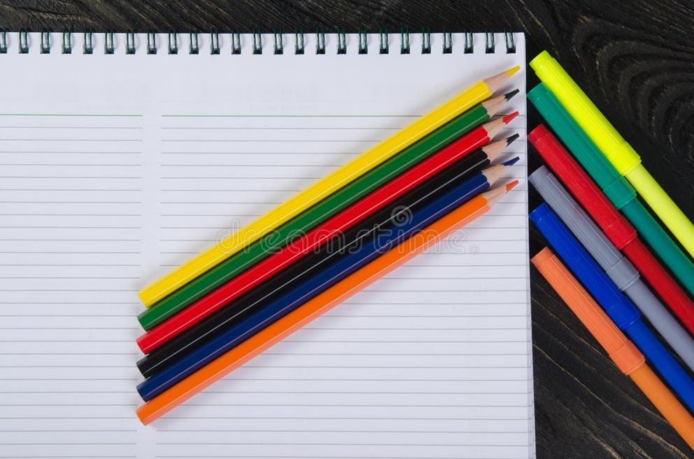 Colored Pencils and a Notebook Stock Photo - Image of design, business ...
