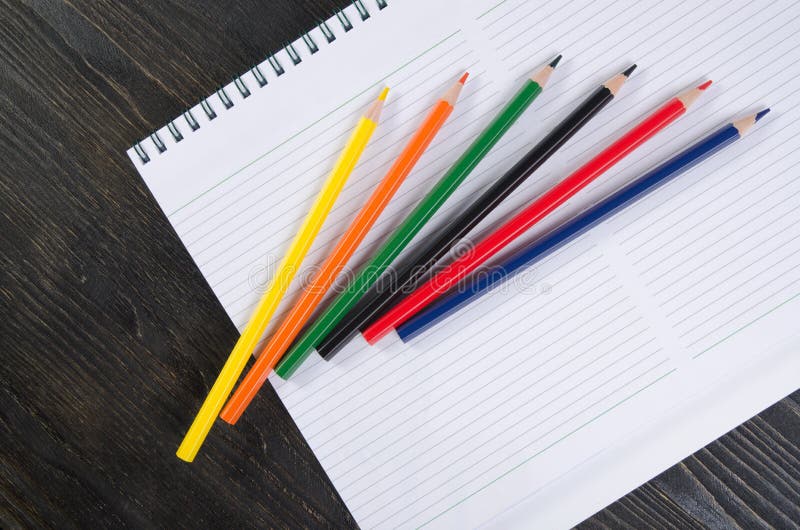Colored Pencils and a Notebook Stock Photo - Image of drawing, concept ...