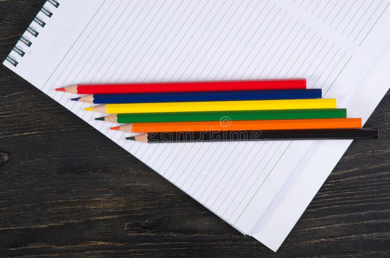 Colored Pencils and a Notebook Stock Image - Image of desk, eraser ...