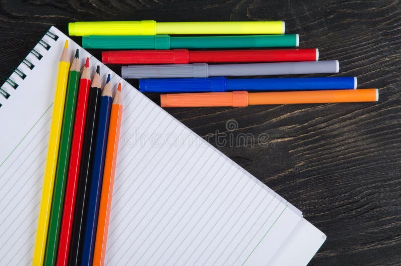 Colored Pencils and a Notebook Stock Image - Image of desk, eraser ...