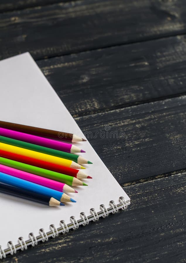Colored Pencils and Notebook Stock Photo - Image of industry, message ...
