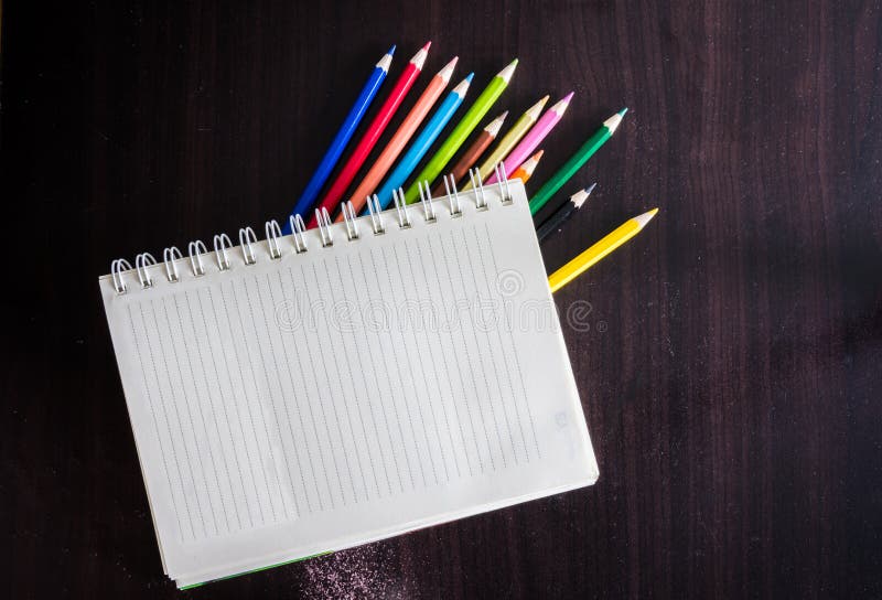 Colored Pencils and Notebook on Wood Texture Stock Image - Image of ...