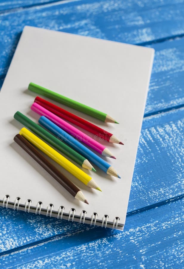 Colored Pencils and Notebook Stock Photo - Image of color, life: 59002514