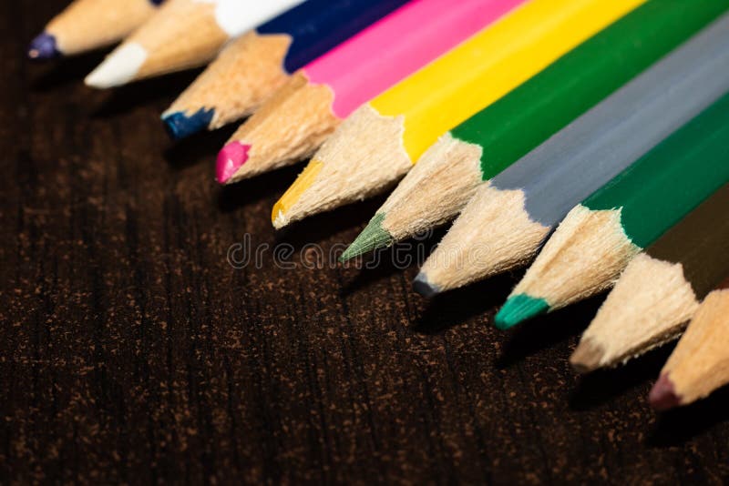 Colored Pencils in a Row on a Wooden Table Stock Image - Image of ...