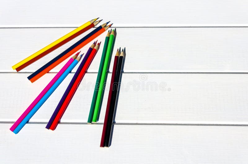 Colored Pencils on White Wooden Table Stock Image - Image of materials ...