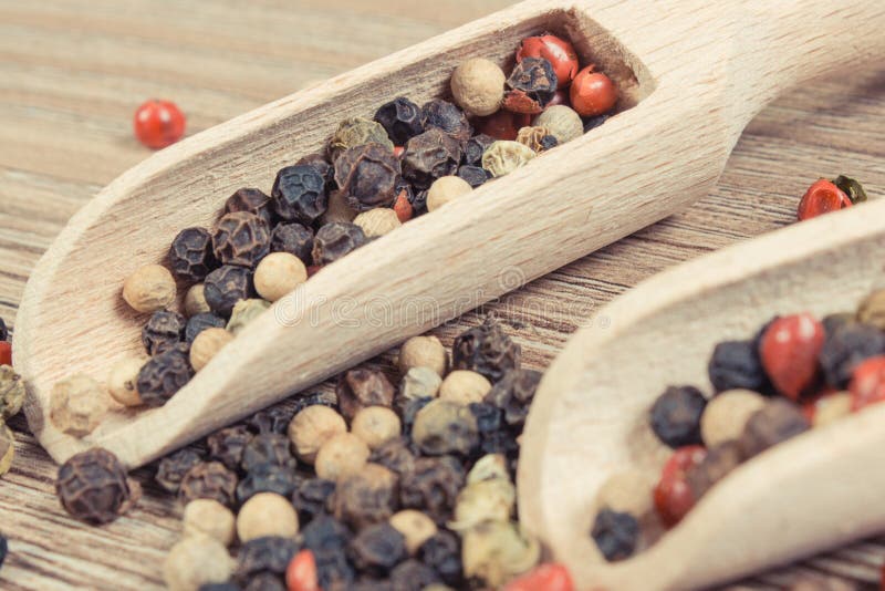 Colored Pepper on Wooden Board. Spice Using for Cooking Stock Photo ...