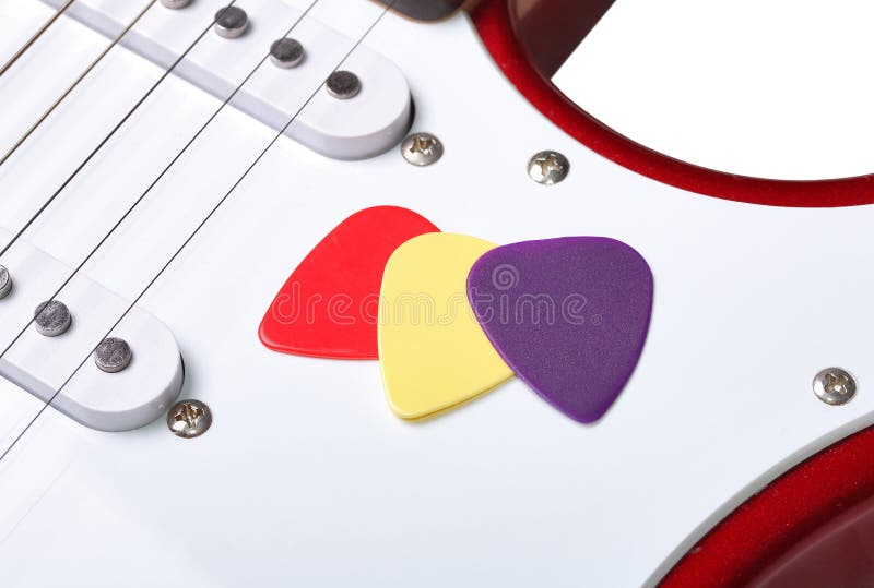 Colored picks on a guitar stock photo. Image of pick - 95889362