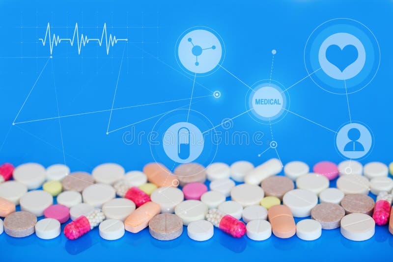 Colored Pills on a Blue Background. Medical Concept. Stock Image ...