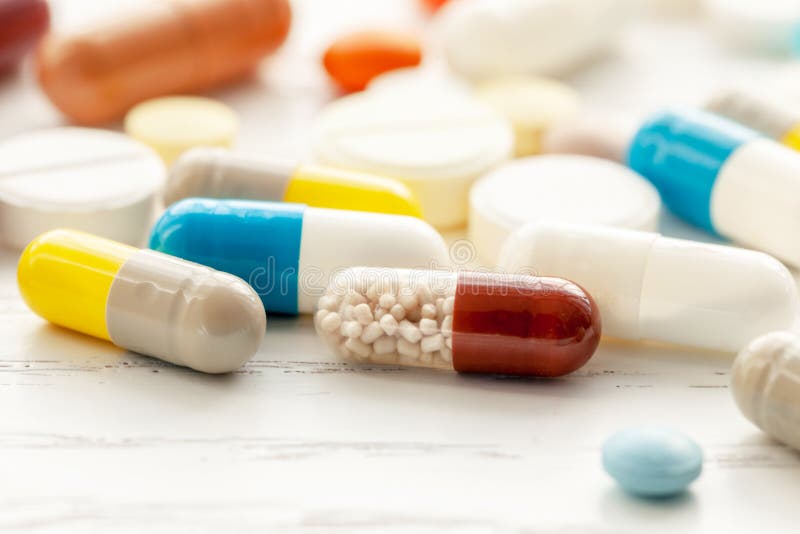 Colored Pills and Capsules on the Table. Stock Photo - Image of cure ...